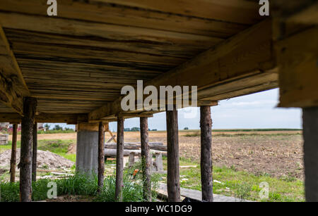 Reinforced concrete slab in the shape of a rectangle on concrete poles ...