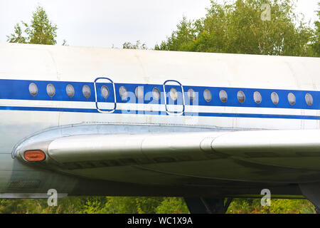 Elements of passenger aircraft with a blue stripe close-up Stock Photo ...