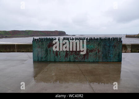 'Widows & Bairns' sculpture in Eyemouth. A memorial shows the widows ...