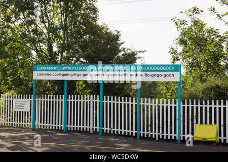 Station sign at Llanfairpwllgwyngyll in North Wales. The longest place ...