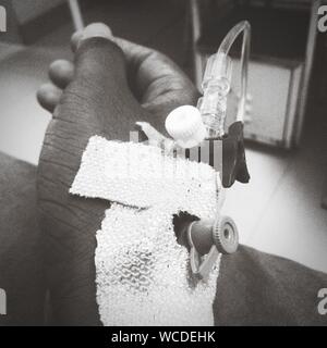 Human hand on IV drip in a hospital Stock Photo - Alamy