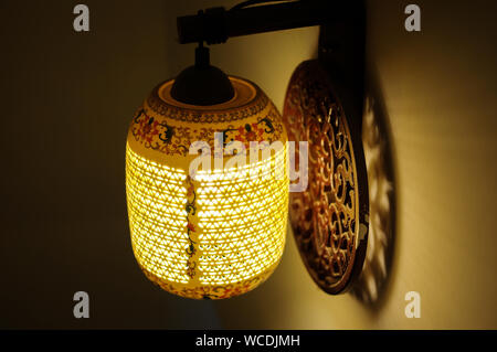 Japan hanging lantern lamp light on wooden post in Japanese garden with ...