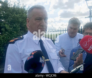 Garda Superintendent Andrew Watters speaks to the media outside ...