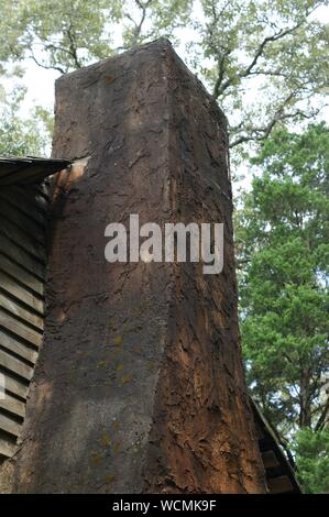 Rustic Log Cabin With Stone Chimney Stock Photo - Alamy