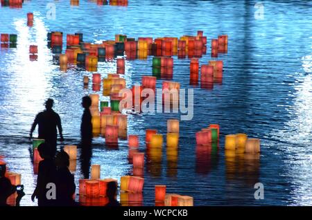 Floating lanterns at night. Japanese lantern lighting ceremony, Haleiwa ...