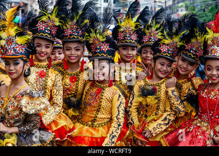 A Group Of Filipino Elementary Schoolchildren Pose For A Photo During ...