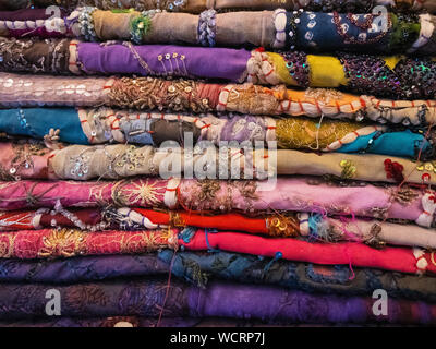 Stack of folded colorful fabrics Stock Photo - Alamy