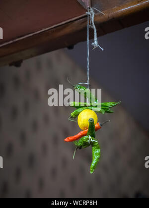 lemon chilies hanging - Indian superstitious lemon and green chillies ...