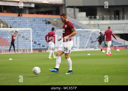 BURNLEY, ENGLAND AUG 28TH Phil Bardlsey and Will Grigg in action during ...