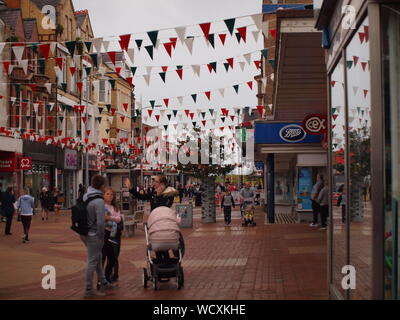 people shopping in the pedestrianised Rhyl town centre, North Wales UK ...