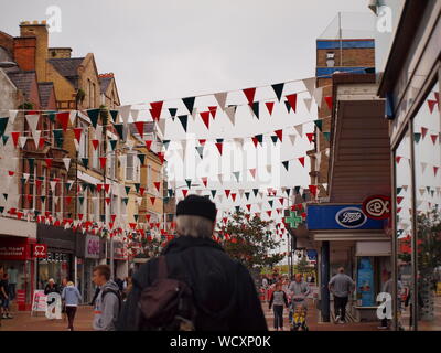 people shopping in the pedestrianised Rhyl town centre, North Wales UK ...