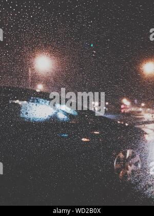 Rainy night through the car window Stock Photo - Alamy