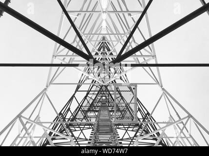 Metal structure is made of steel against blue sky. Abstract modern ...