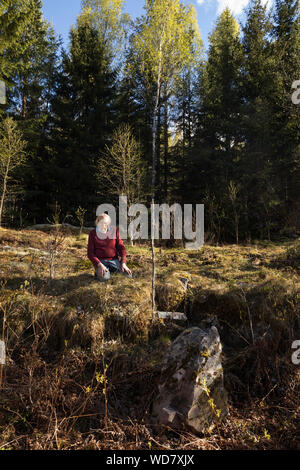 Man sitting in the field Stock Photo - Alamy