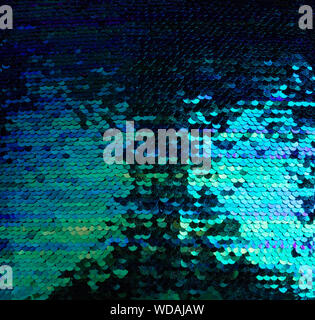 GREEN shimmering glitter material background with glowing effects and ...