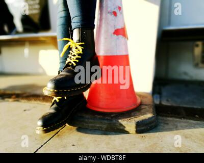 Close up of one traffic cone on a road with path Stock Photo - Alamy