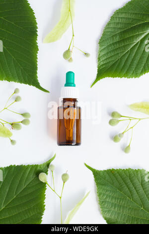 Dropper bottle with oil and lime isolated on white background Stock ...