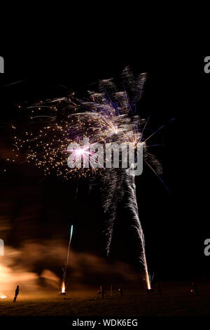 Long exposure of people letting off fireworks Stock Photo - Alamy