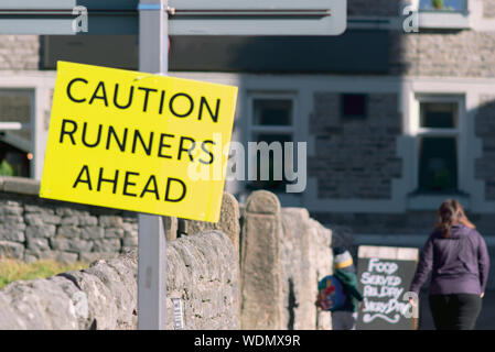 Caution runners sign Stock Photo - Alamy
