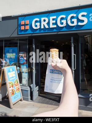 A Greggs, vegan-friendly, sausage roll sitting on top of some Greggs ...
