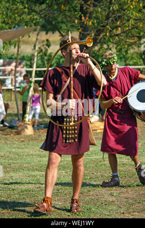 The cornu, an ancient Roman musical instrument, is depicted alongside a ...