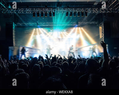 Colourful concert hall with clapping people Stock Photo - Alamy