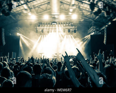 Colourful concert hall with clapping people Stock Photo - Alamy