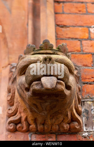 Stone statue of a crowned lion with its tongue out at Schweizertor ...