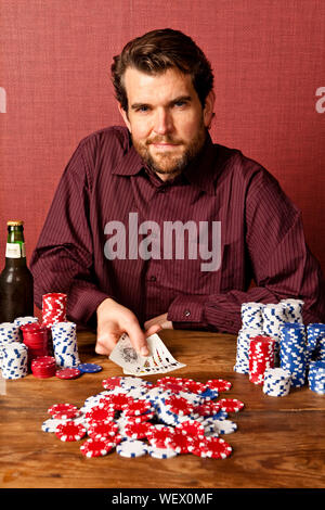Business man with winning cards Stock Photo - Alamy