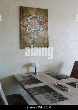 Dining room table with wall map Stock Photo - Alamy