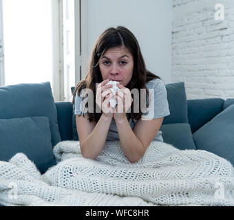 Sick young woman with thermometer on color background Stock Photo - Alamy