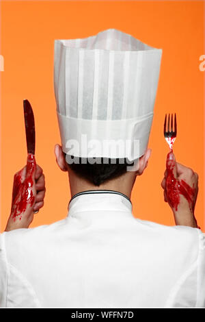 Hand holding bloody knife Stock Photo - Alamy