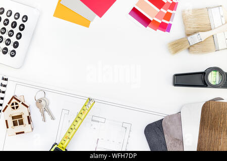 Overhead view of blueprint and equipment on table in auto repair shop ...