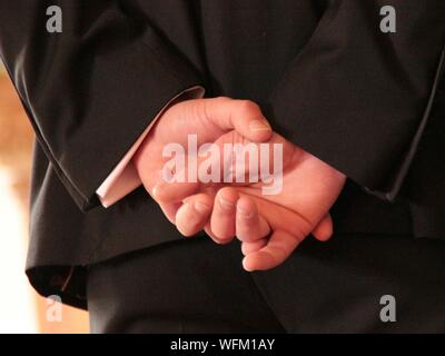 Clasped hands behind back, rear view, cropped Stock Photo: 40228661 - Alamy
