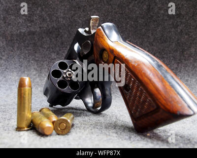 A used long barrel .38 special Taurus revolver gun displayed at a ...