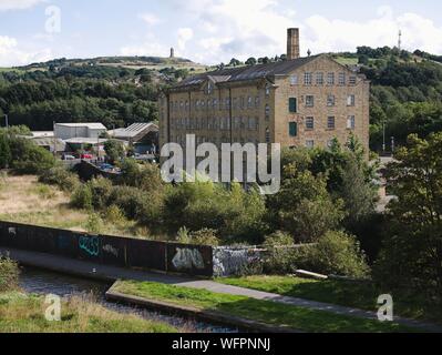 The Huddersfield Narrow Canal and old Mill building at Slaithwaite in ...