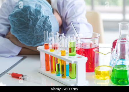 Tired scientist at laboratory Stock Photo - Alamy