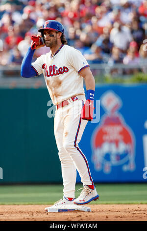 Philadelphia Phillies' Bryce Harper, second from right, yells in the ...