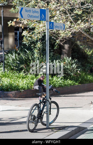 Bicycle parked in the city, tied or padlocked to a bar to prevent it ...