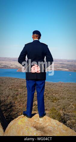 Rear view of soldier standing with his hands behind back Stock Photo ...
