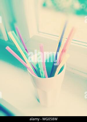 Colorful drinking straws in glass of water Stock Photo - Alamy