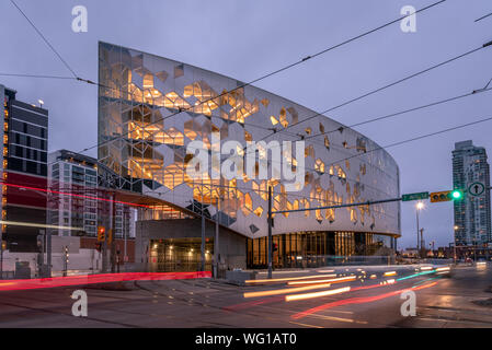 Exterior of the New Calgary Central Library. The exterior is a textured ...