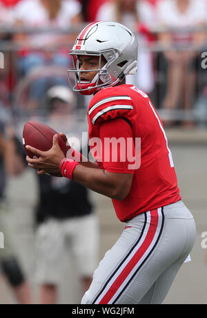Ohio State quarterback Justin Fields drops back to pass during the ...
