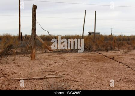 Barbed Wire On A Broken Fence Stock Photo - Alamy
