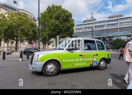 Green London taxi cab advertising says: 'Green is the new black' Stock ...