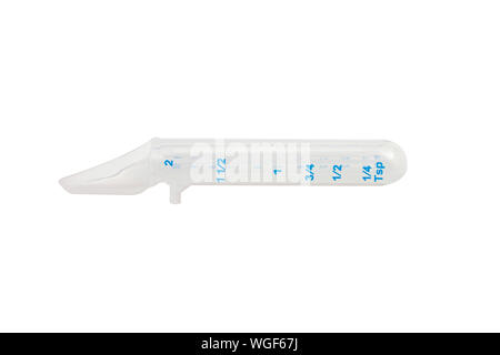 Medicine dosing spoon on white background Stock Photo - Alamy