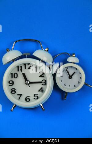 Clock marking winter time change over checkered background Stock Photo ...