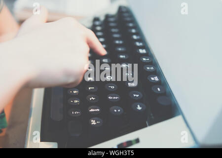 close-up of hand typing text on computer keyboard Stock Photo - Alamy