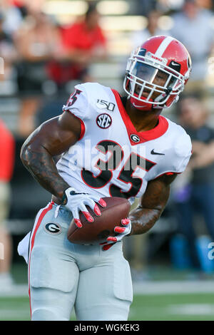 Georgia running back Brian Herrien (35) runs out of bounds and into a ...