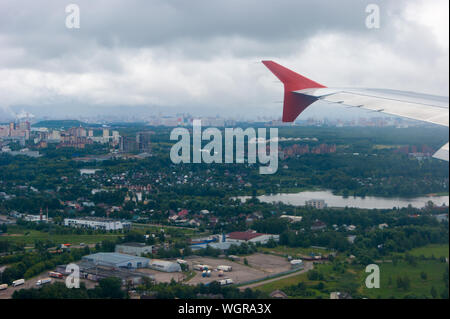 airplane flying over Earth Stock Photo - Alamy